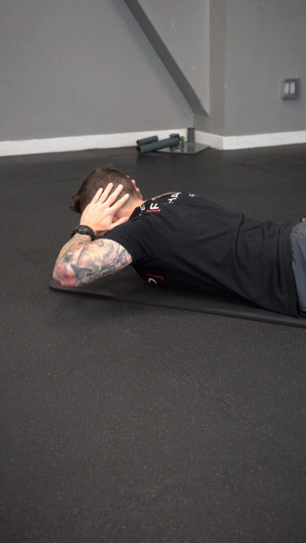 Prone Thoracic Extension - Hands Behind Head - [P]rehab